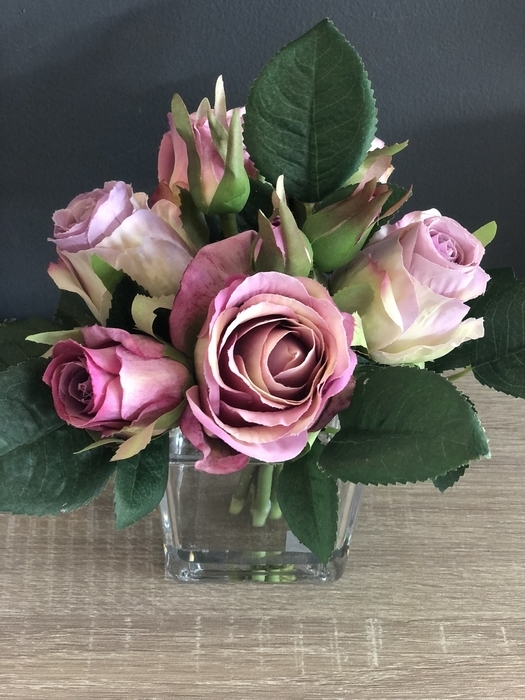 Mauve pink silk roses in cube vase in resin